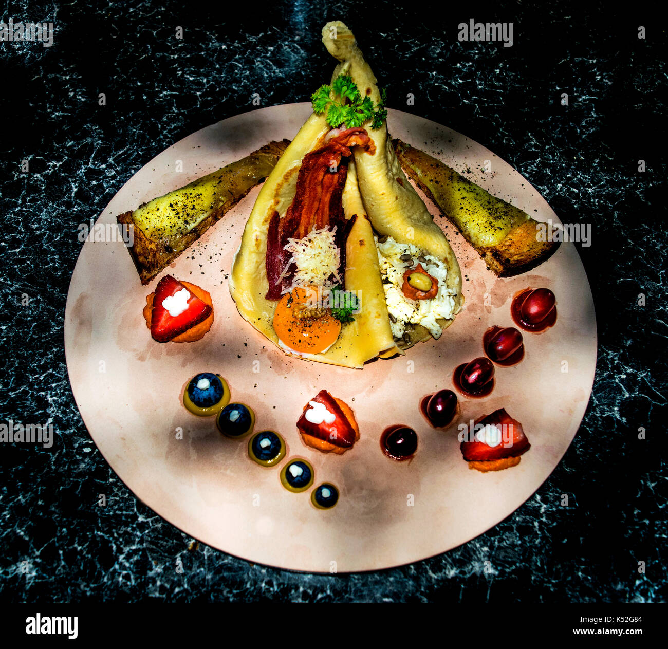 Delicious cuisine breakfast on a large round fat plate Stock Photo - Alamy