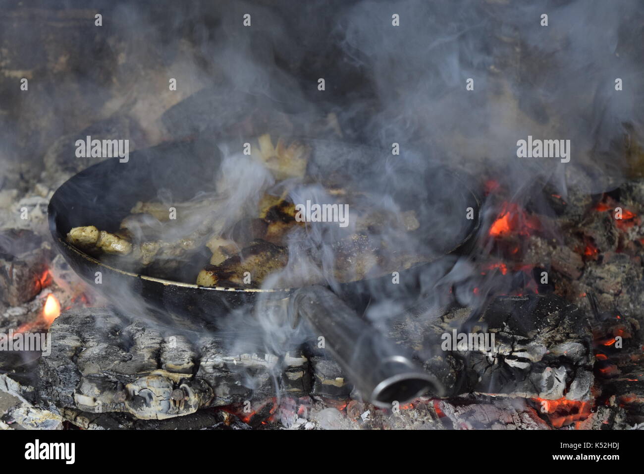 Smoky hot barbecue cooking meat Stock Photo - Alamy
