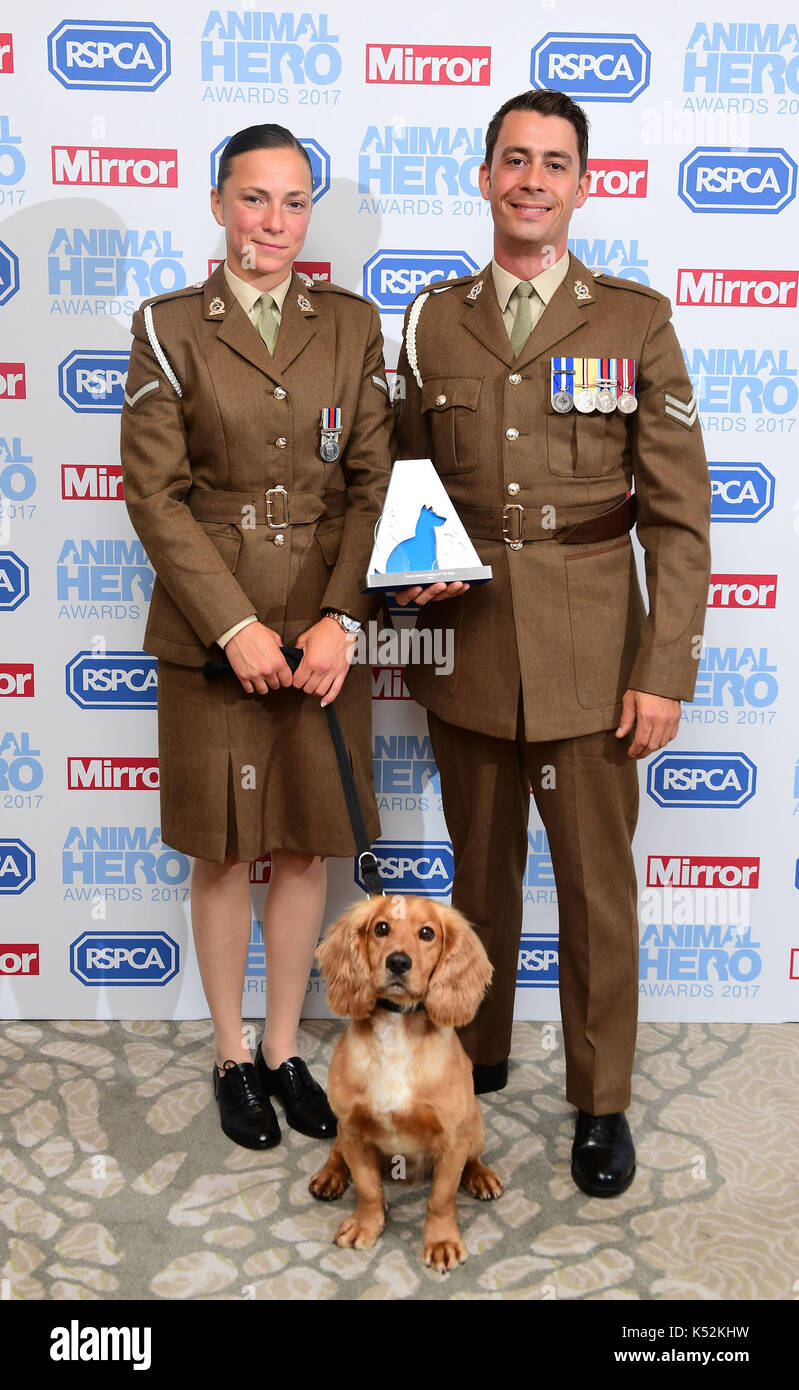 Sam, winner of the 2nd Public Service Animal of the Year award with ...