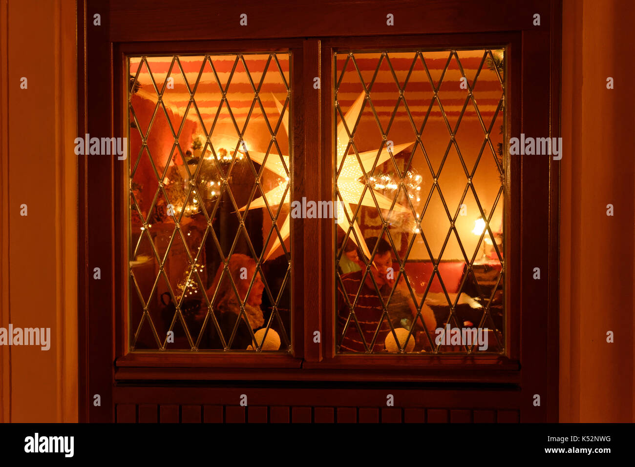 Illuminated christmas star behind the window of a tavern in Erbach in ...