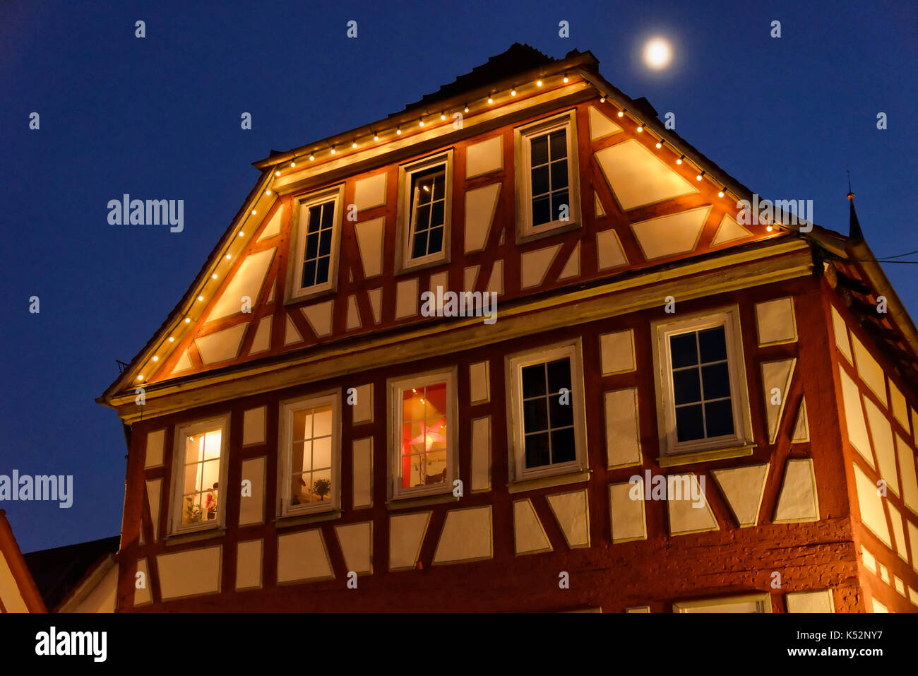 Festive illuminated half-timbered house in the old town of Erbach in ...