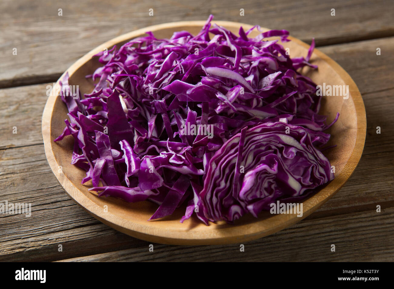 Close up of red cabbage in wooden plate Stock Photo - Alamy