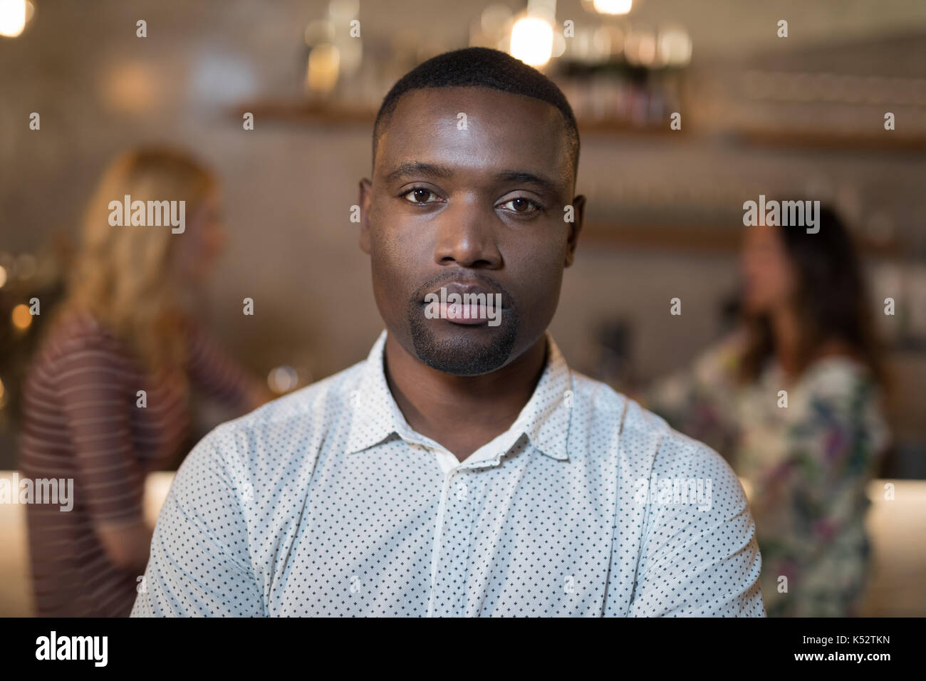 Portrait of man standing in restaurant Stock Photo - Alamy
