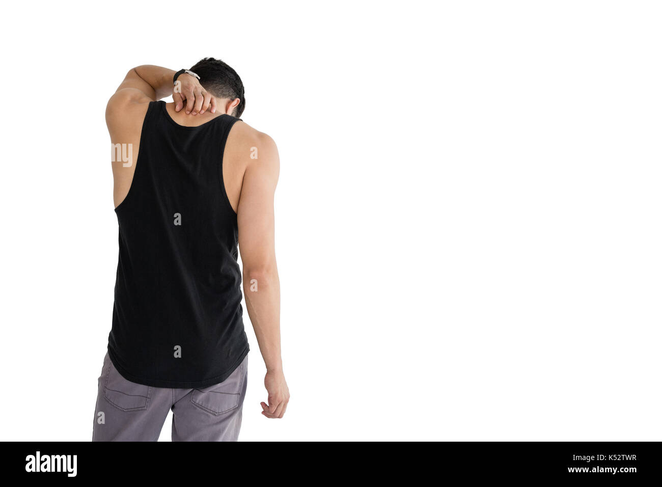 Rear view of man standing against white background Stock Photo - Alamy