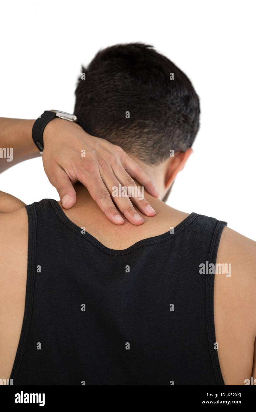 Rear view of man touching his neck against white background Stock Photo ...