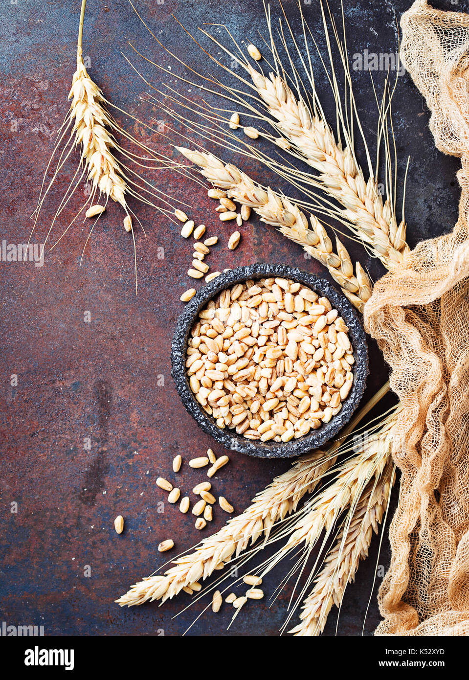 Wheat grains and spikelets on rusty background Stock Photo - Alamy
