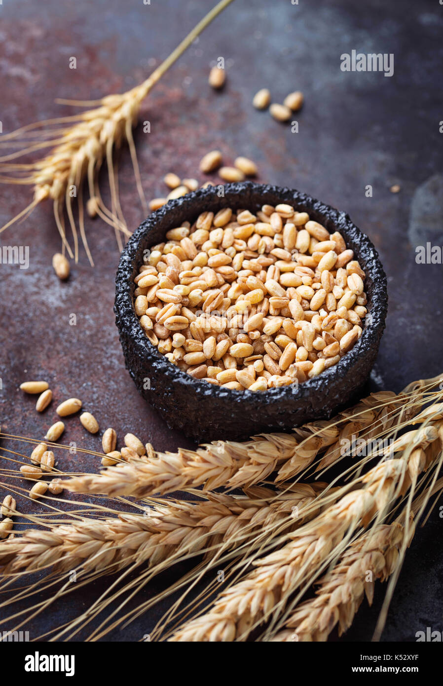 Wheat grains and spikelets on rusty background Stock Photo - Alamy