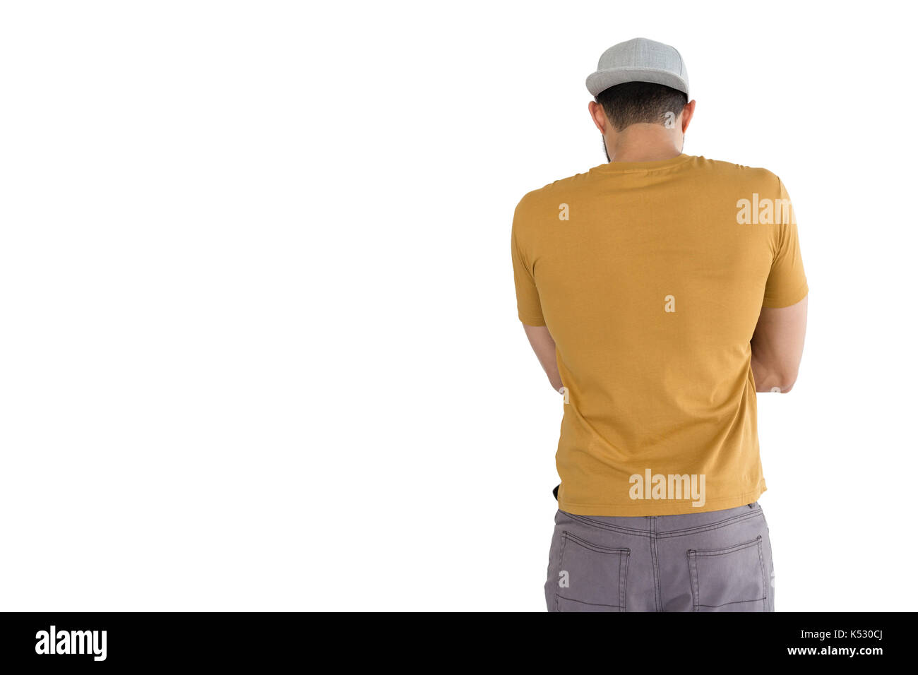 Rear view of man standing against white background Stock Photo - Alamy