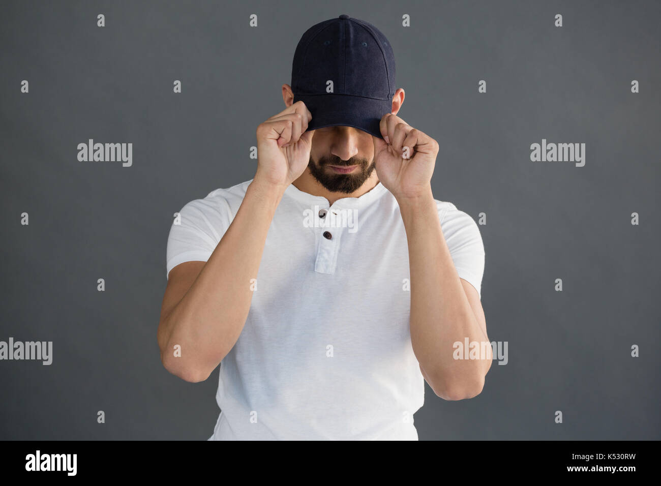 Posing with cap hi-res stock photography and images - Alamy