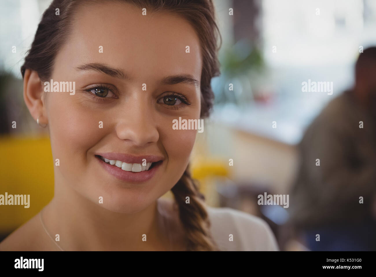 Close-up portrait of waitress at cafe Stock Photo - Alamy