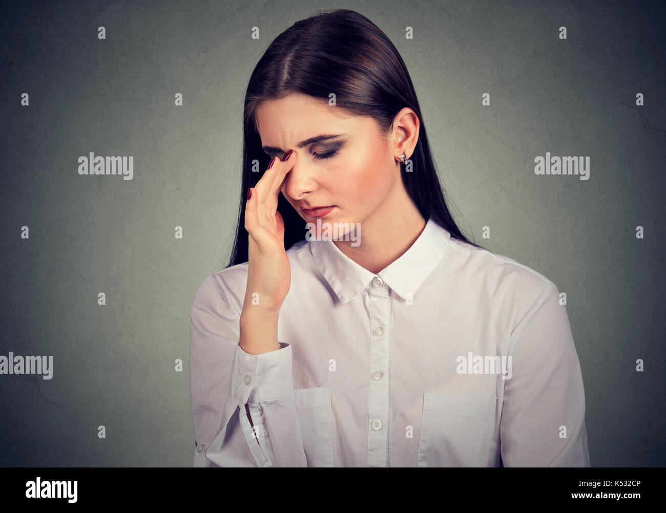 Stressed sad young woman in a desperate situation looking down Stock ...