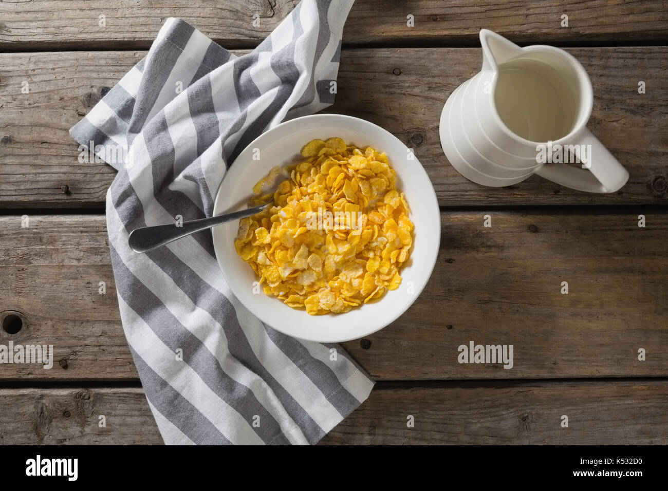 Bowl of wheaties cereal and milk with spoon on wooden table Stock Photo ...