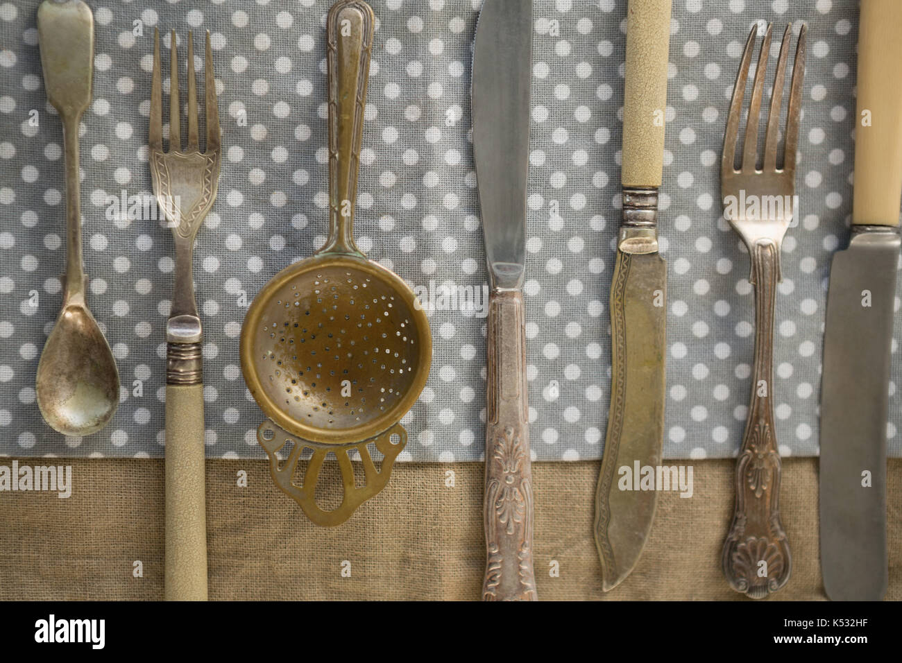 Directly above shot of cutlery arranged side by side on napkin Stock ...