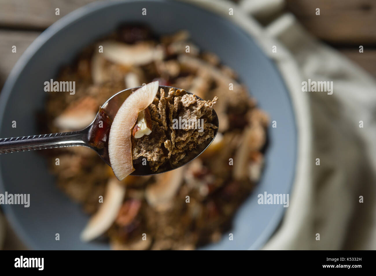 Close-up of breakfast cereal in bowl on wooden table Stock Photo - Alamy