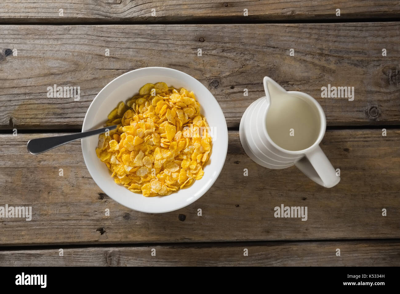 Bowl of wheaties cereal and milk with spoon on wooden table Stock Photo ...