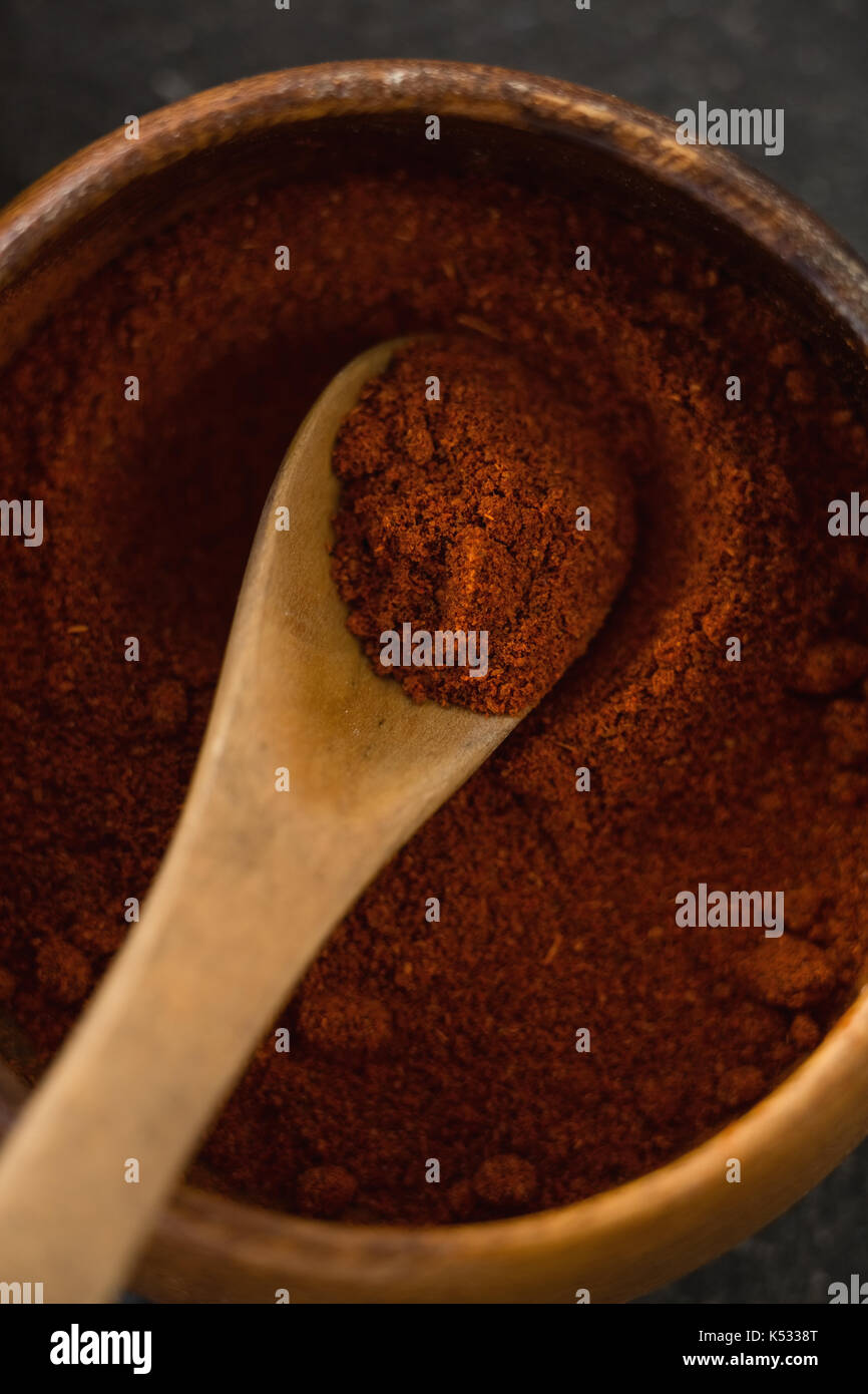 Overhead view of grounded food in wooden bowl on table Stock Photo - Alamy