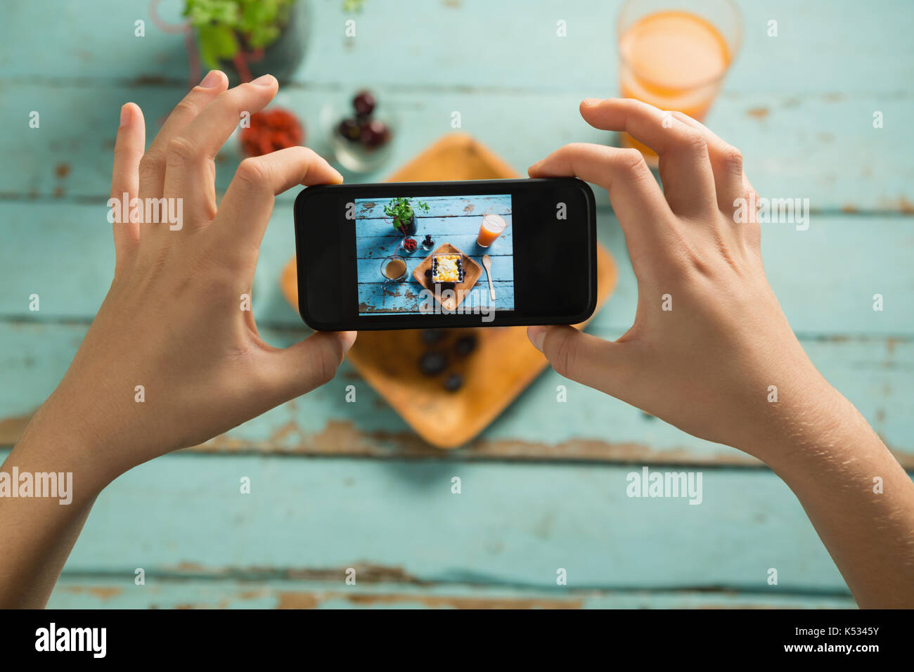 Close-up of hands taking photo of breakfast with mobile phone Stock ...