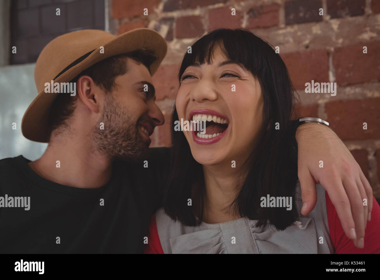 Man whispering in woman ear hi-res stock photography and images - Alamy