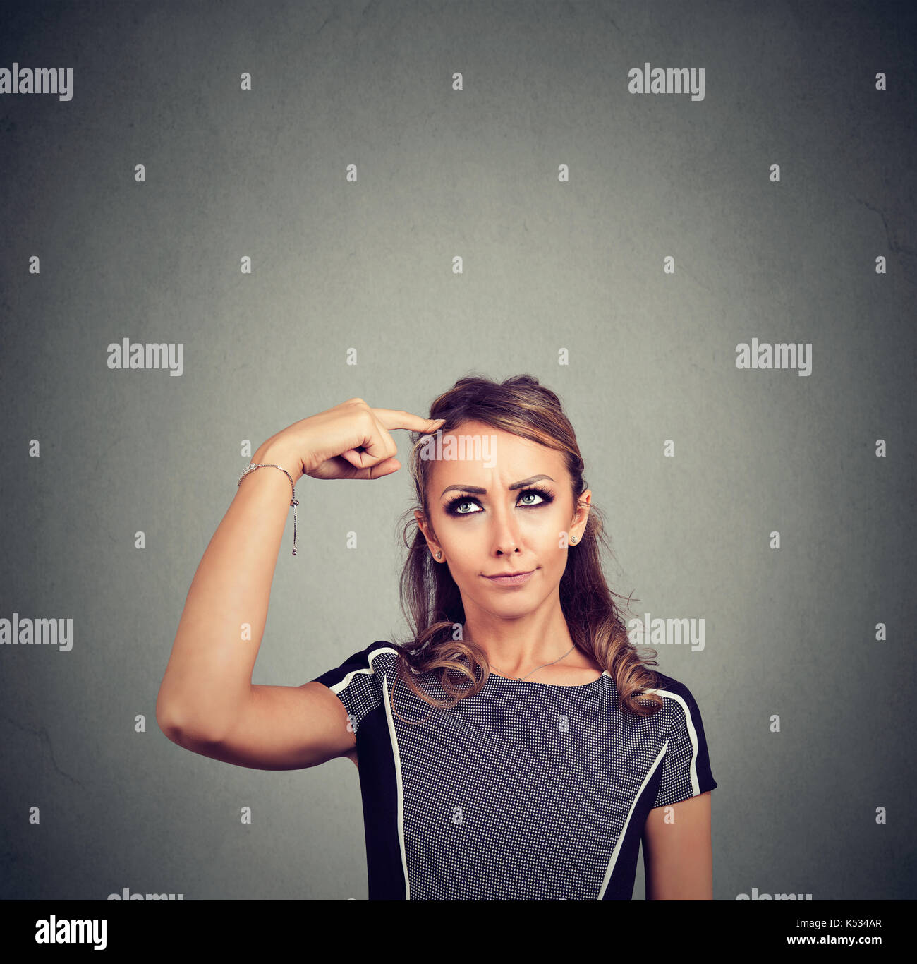 Frowning adult solving difficult hi-res stock photography and images ...