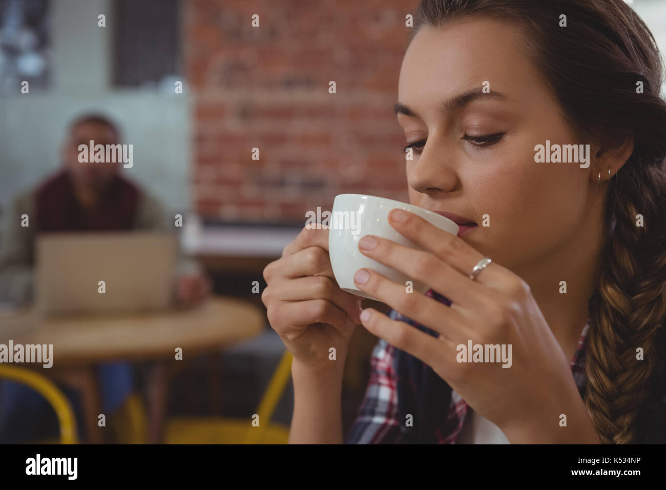 Young woman drinking coffee cafe hi-res stock photography and images ...