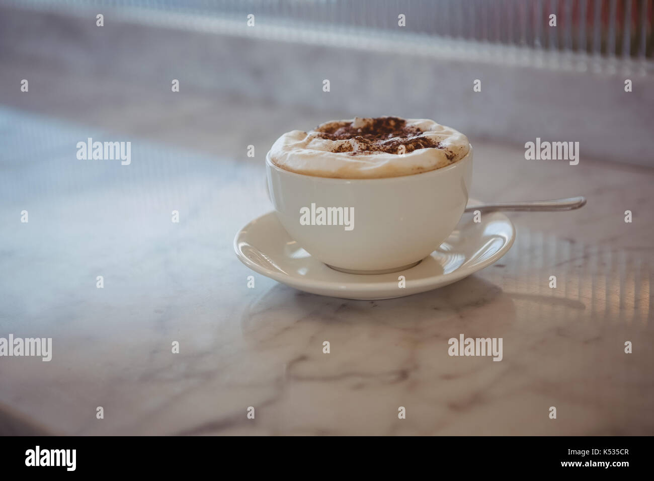 Coffee cup on counter at cafe Stock Photo - Alamy