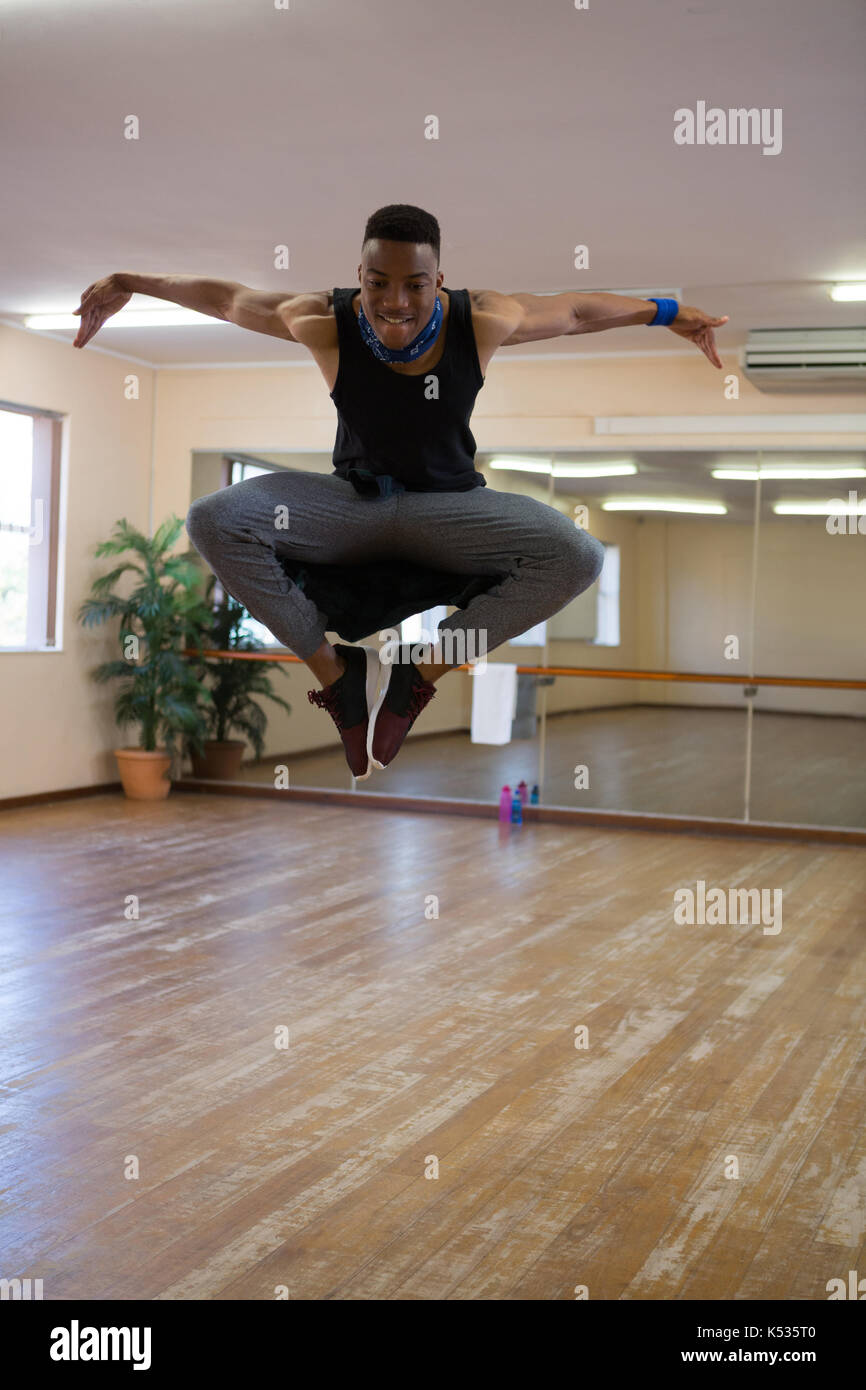 Young man jumping over railing hi-res stock photography and images - Alamy