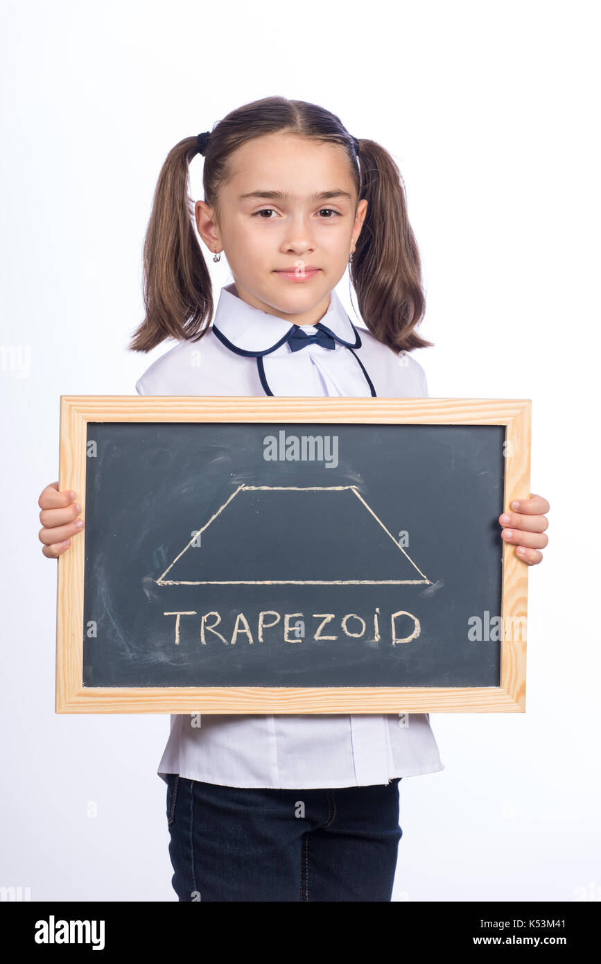 8 year old school girl with chalkboard displaying a trapezoid shape ...