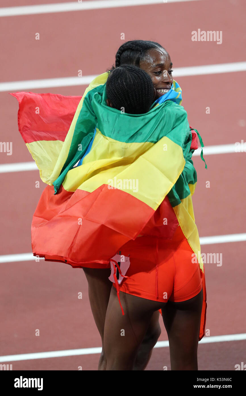 Dera DIDA (Ethiopia), Almaz AYANA (Ethiopia) draped in the Ethiopian ...