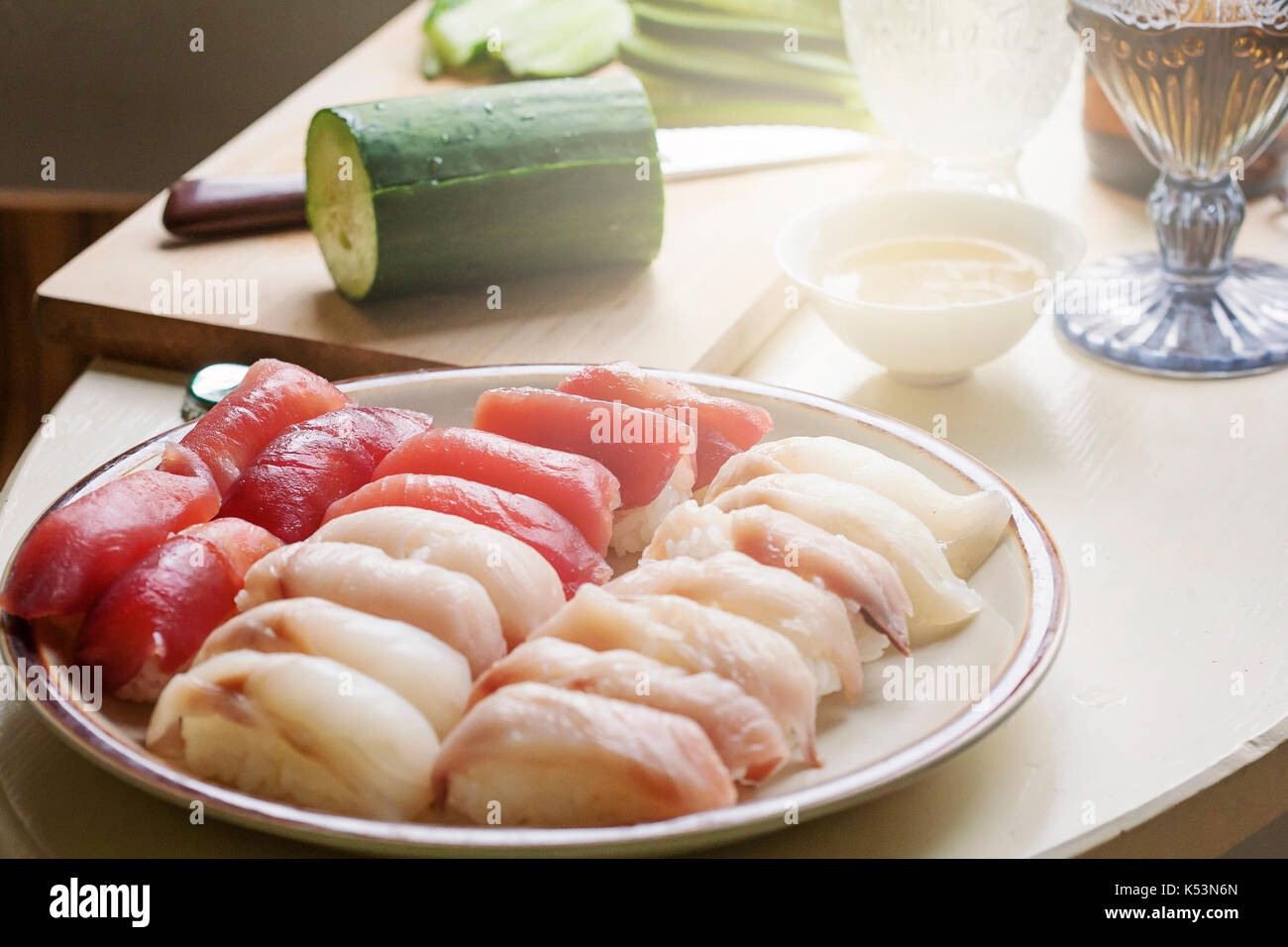 Kitchen table with japanese sushi Stock Photo - Alamy