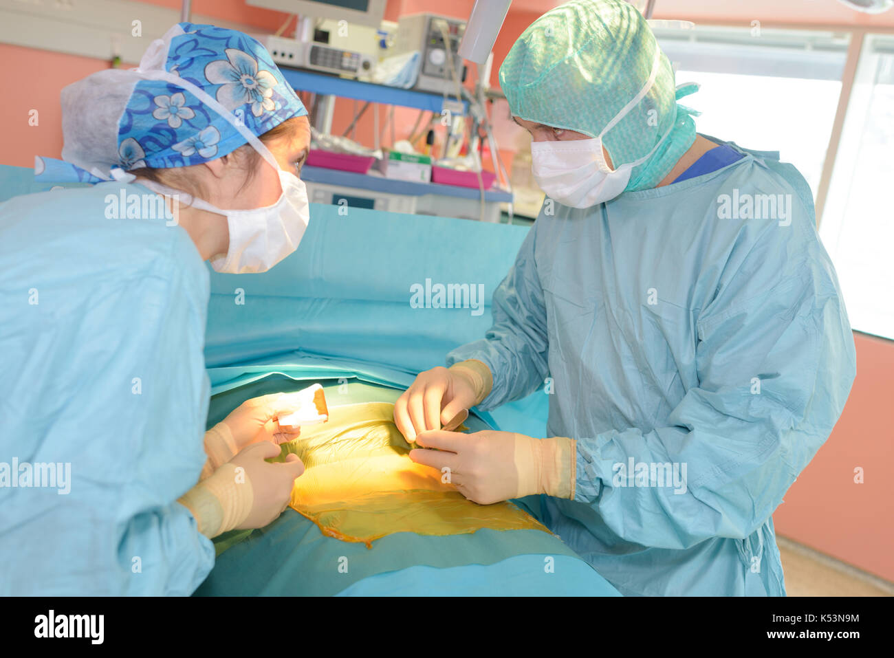 surgeons interacting with each other while operation Stock Photo - Alamy