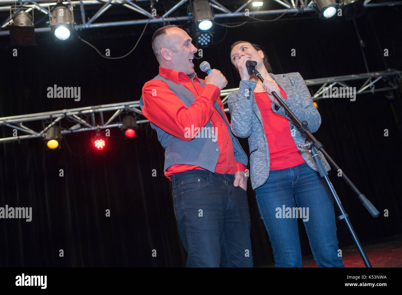 male and female singing performance Stock Photo - Alamy
