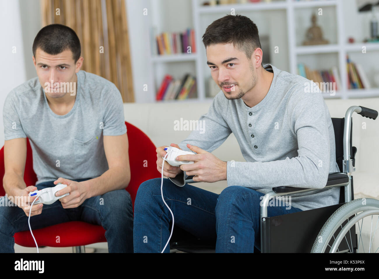 Two guys playing video games hi-res stock photography and images - Alamy