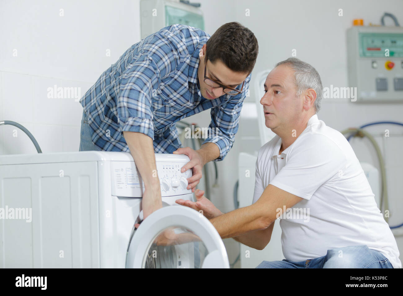 professional workmen visiting client after-sales service at home Stock ...