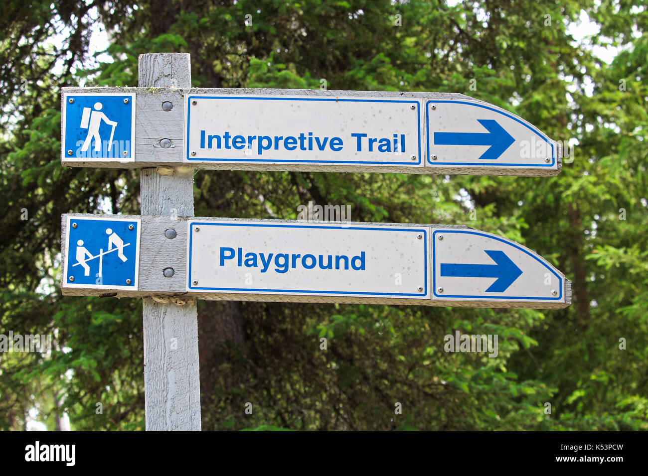 A direction sign for an interpretive trail and playground Stock Photo ...