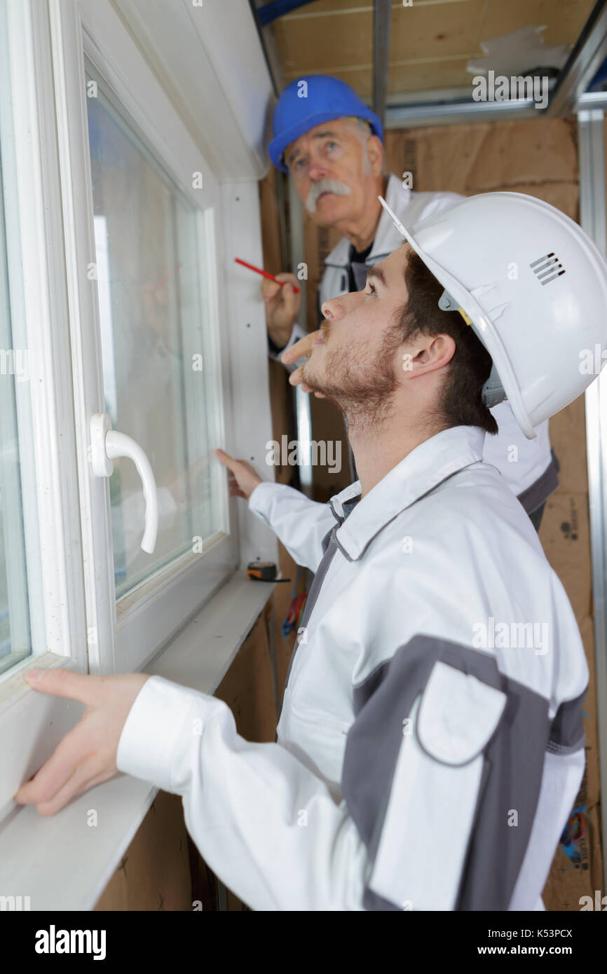 windows installation workers Stock Photo - Alamy