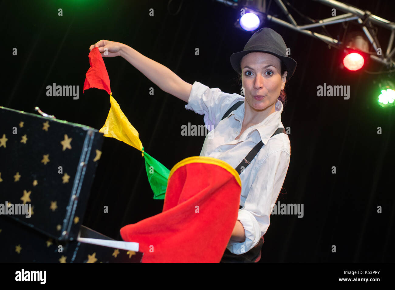 beautiful young magician on stage Stock Photo - Alamy