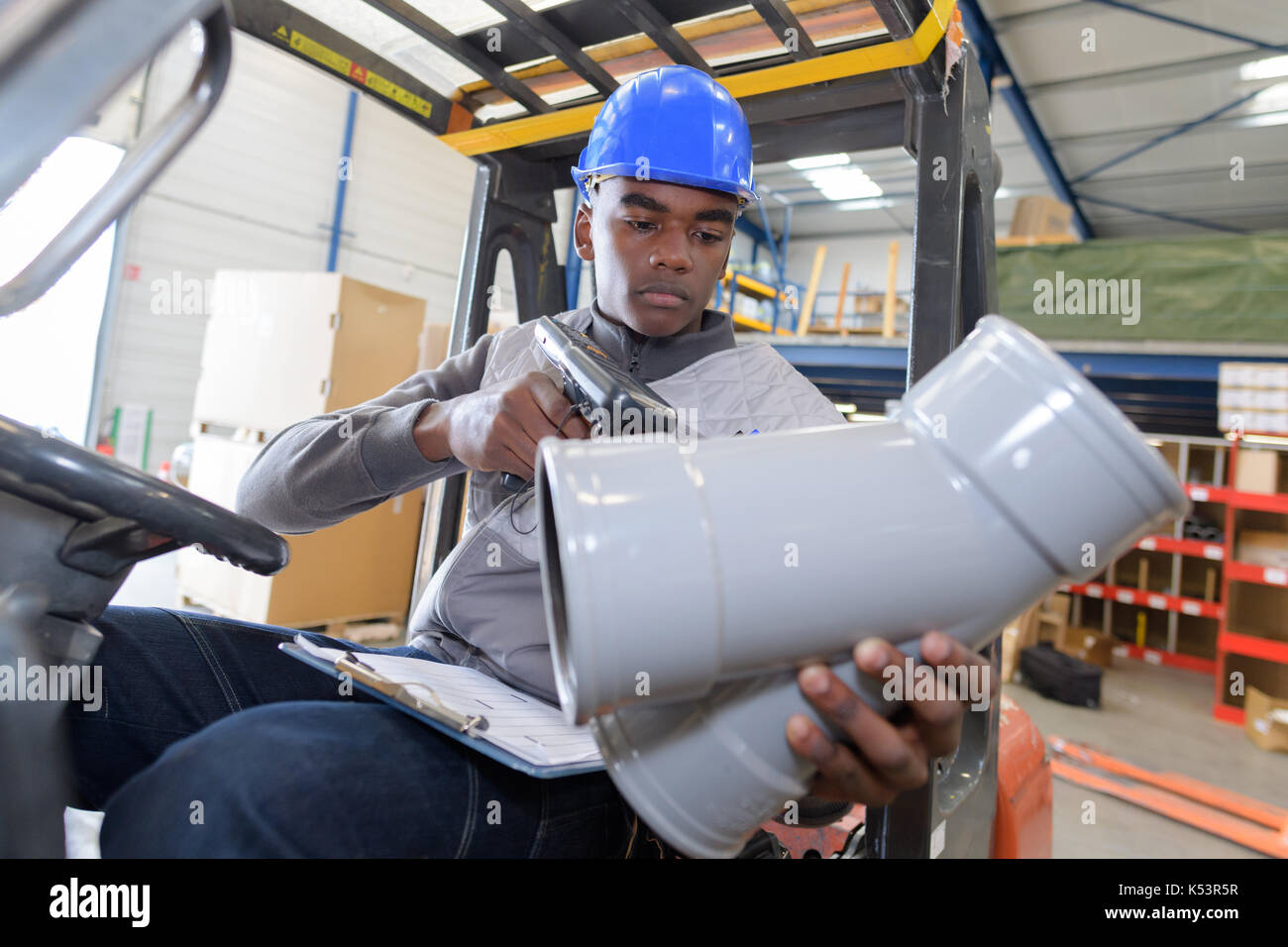 worker scanning package in warehouse Stock Photo - Alamy
