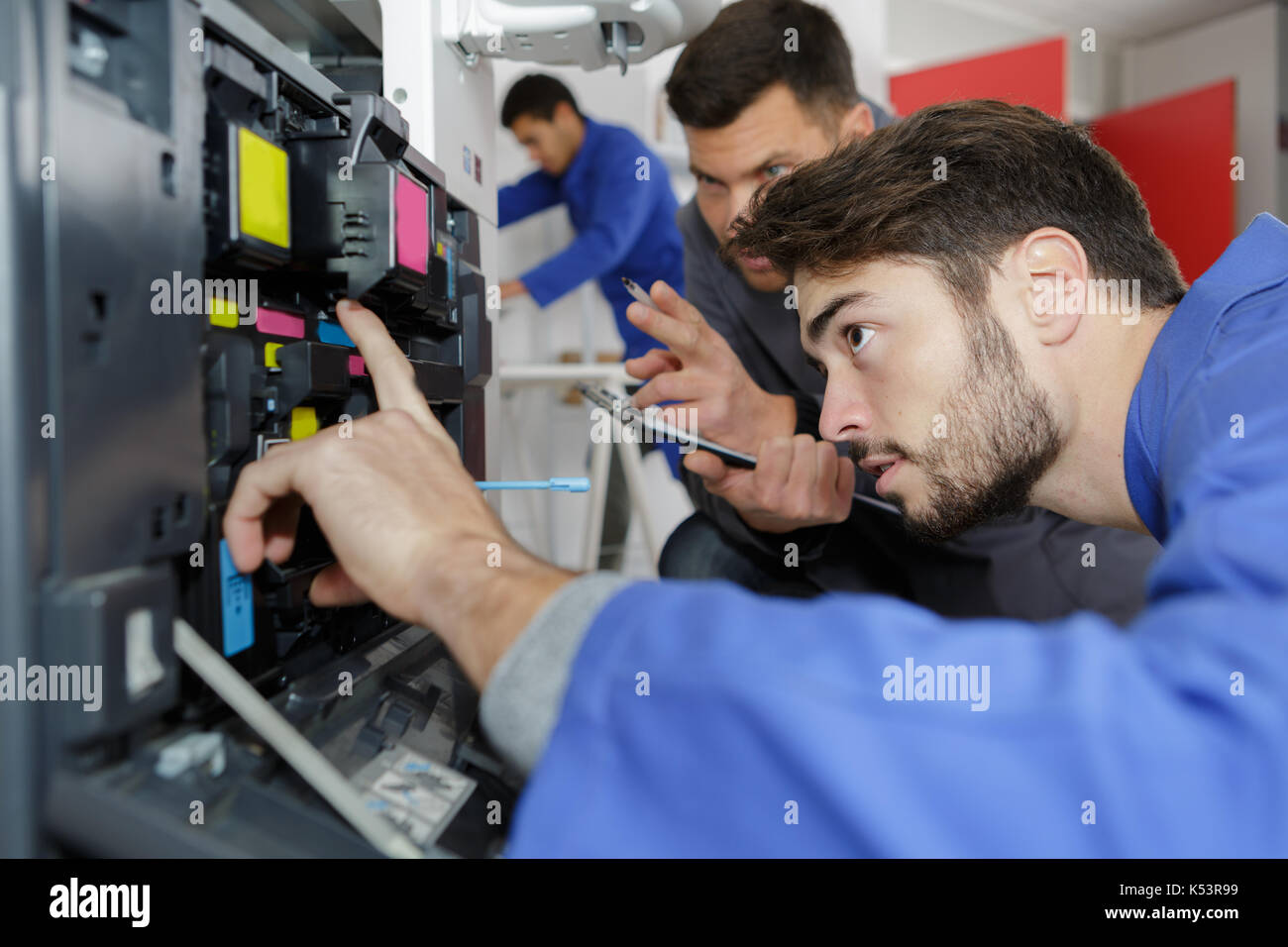 portrait of young man by printing machine Stock Photo - Alamy