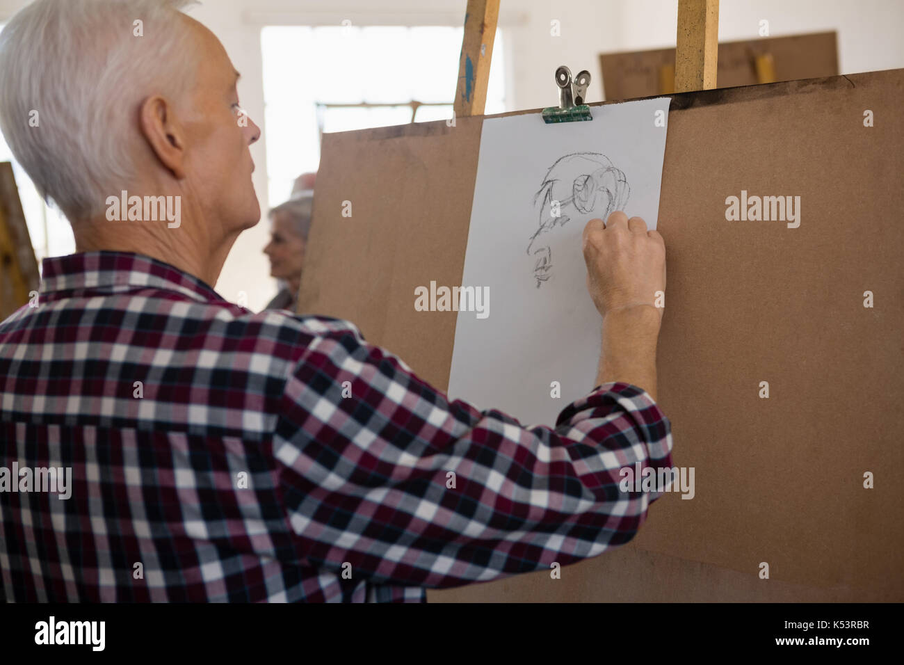 Senior man male drawing sketching hi-res stock photography and images ...