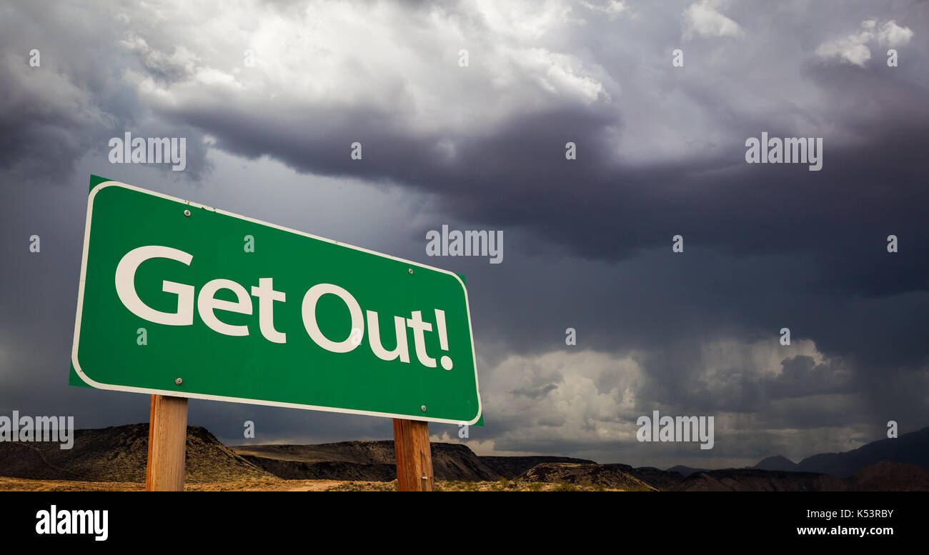 Get Out Green Road Sign with Dramatic Clouds and Rain Stock Photo - Alamy
