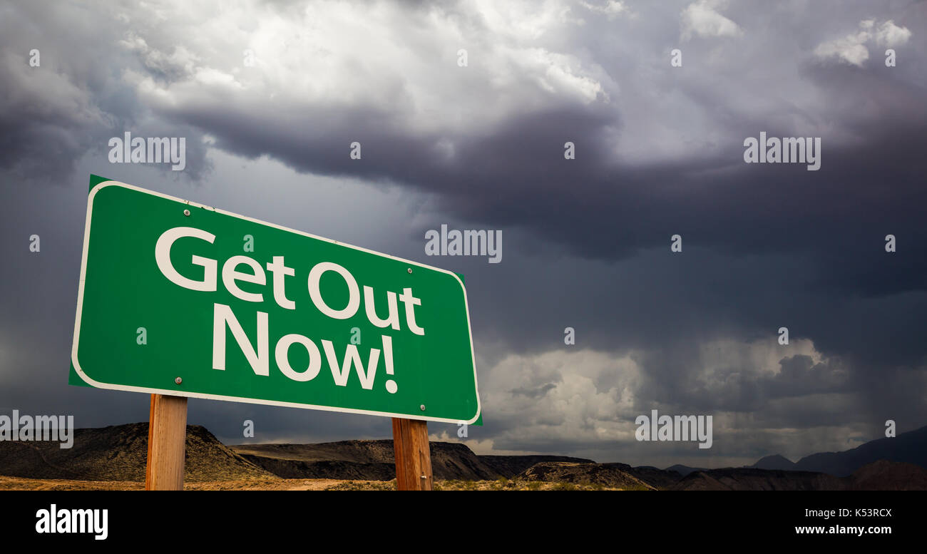 Get Out Green Road Sign with Dramatic Clouds and Rain Stock Photo - Alamy
