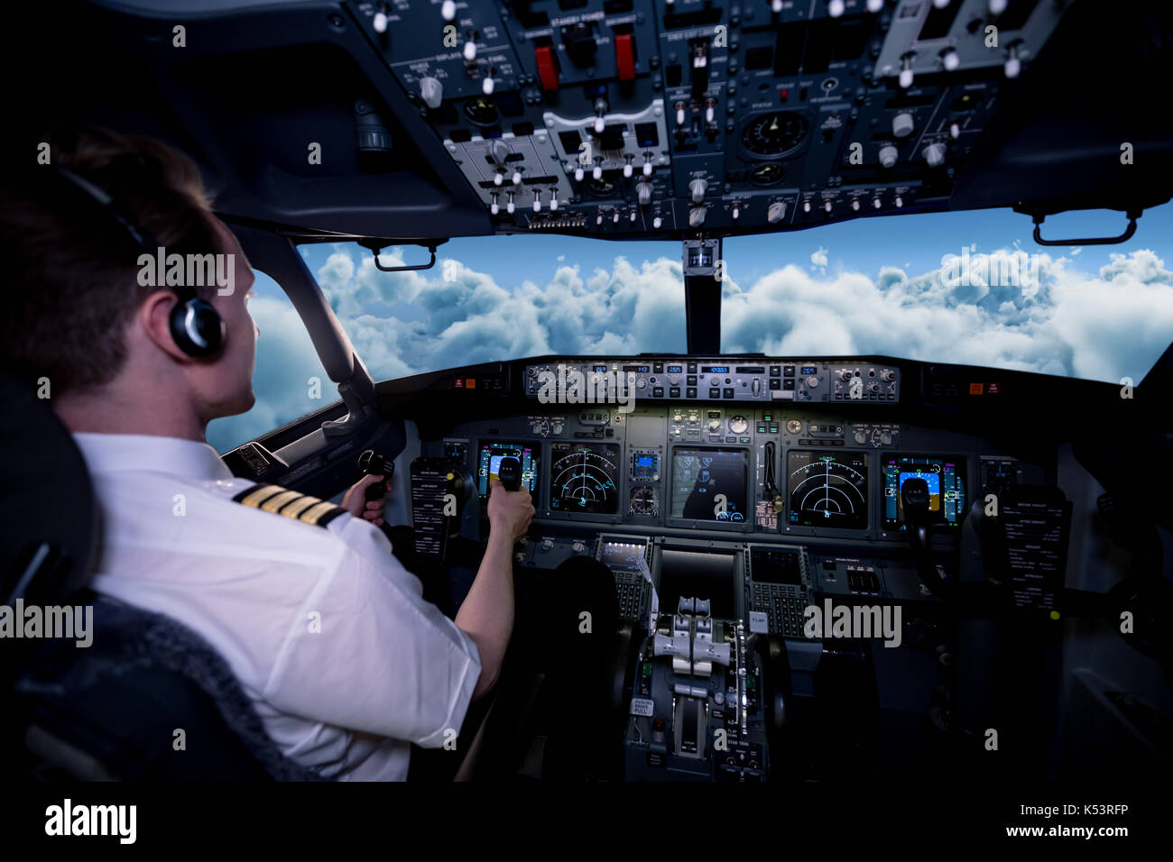 Young male pilot flying airplane from cockpit Stock Photo - Alamy