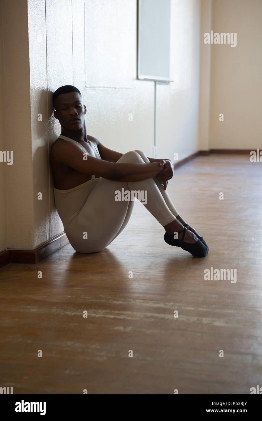 Upset man leaning against wall hi-res stock photography and images - Alamy