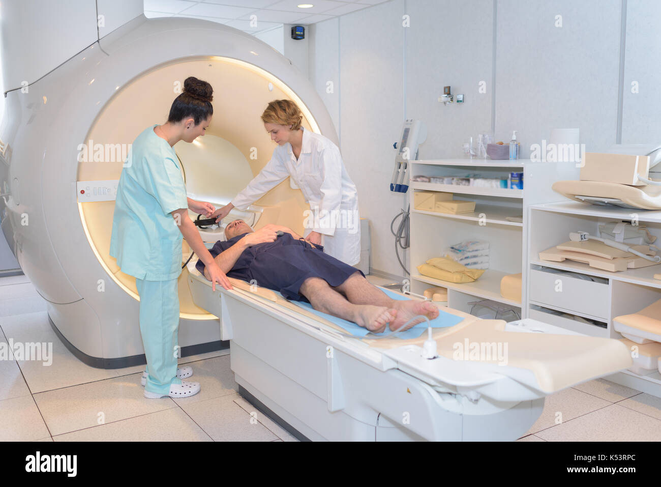 happy patient undergoing mri scan at hospital Stock Photo - Alamy