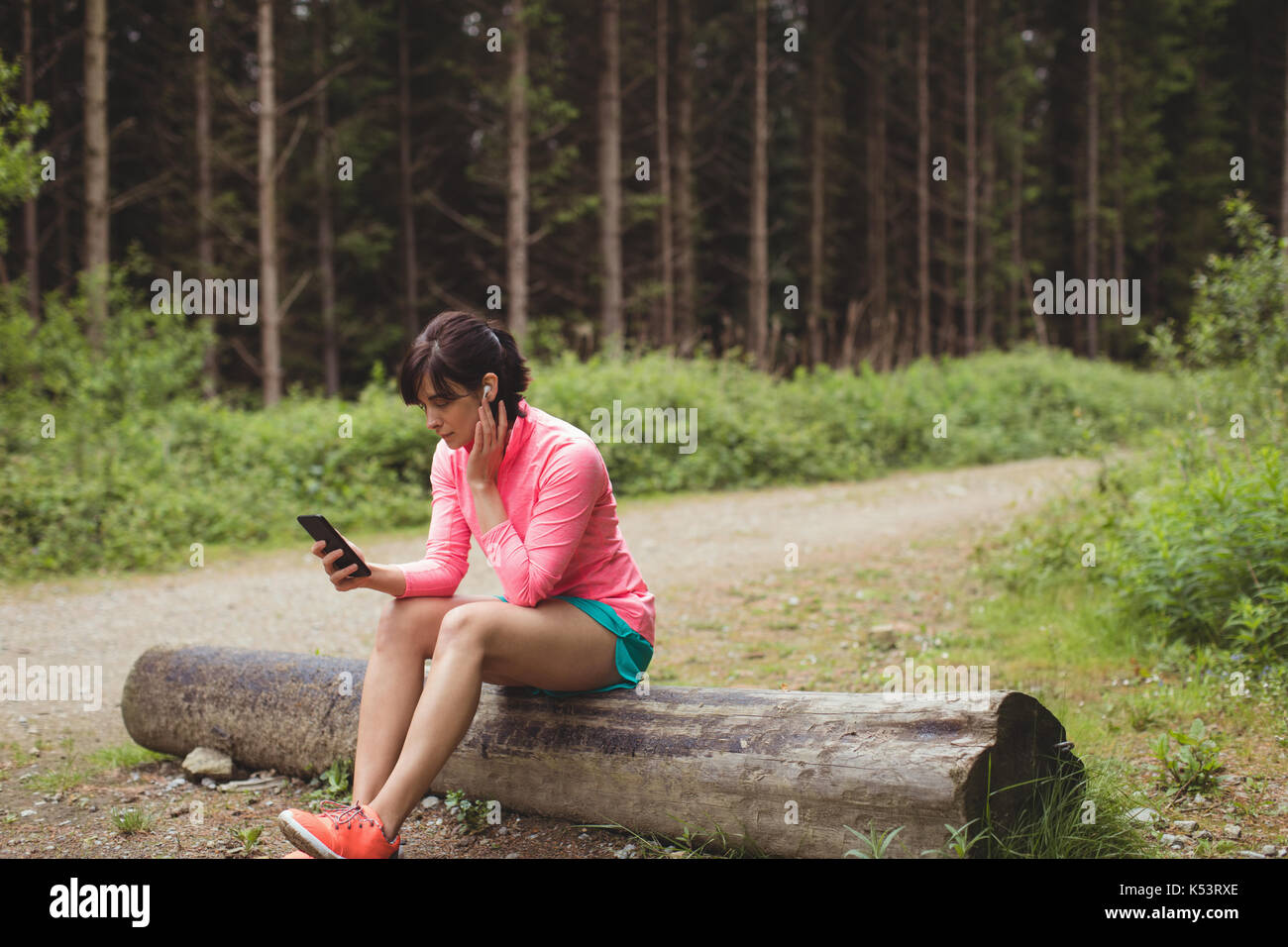 Caucasian woman sitting log wood hi-res stock photography and images ...