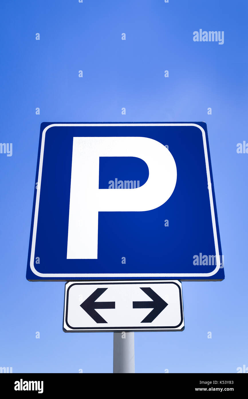 Free parking signal, for both street sides, with the blue sky in the ...