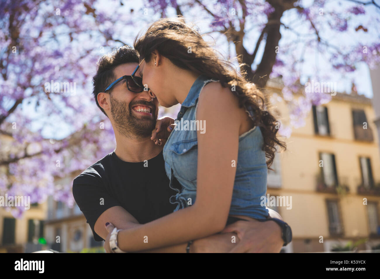 Portrait of happy couple hugging leaning on each other head Stock Photo ...