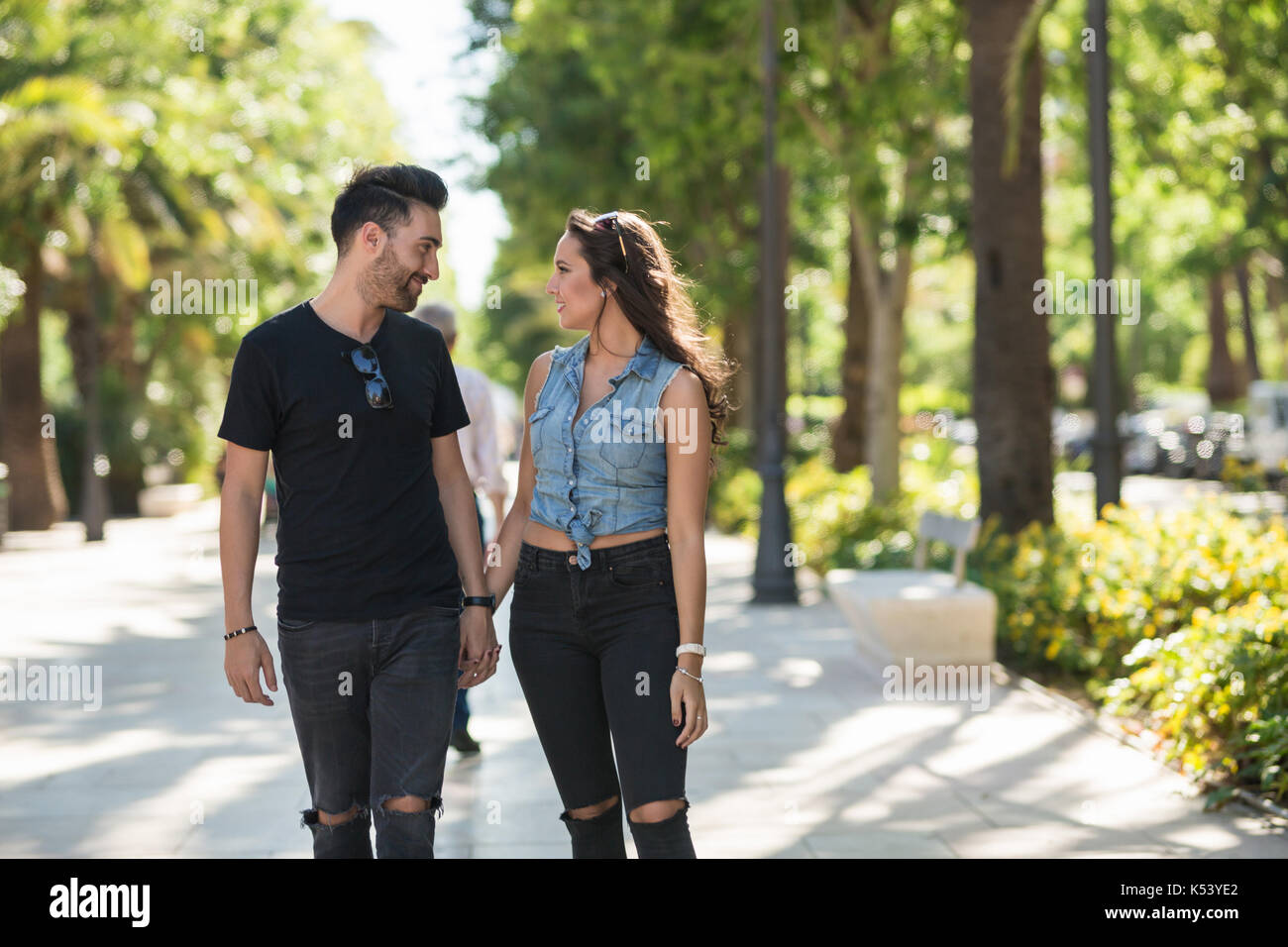 Couple walking side profile hi-res stock photography and images - Alamy