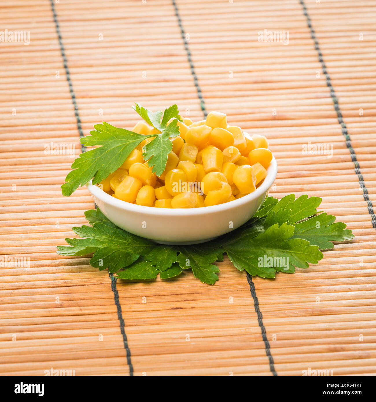 cooked sweet corn seeds in a bowl on a wooden table. canned corn Stock ...