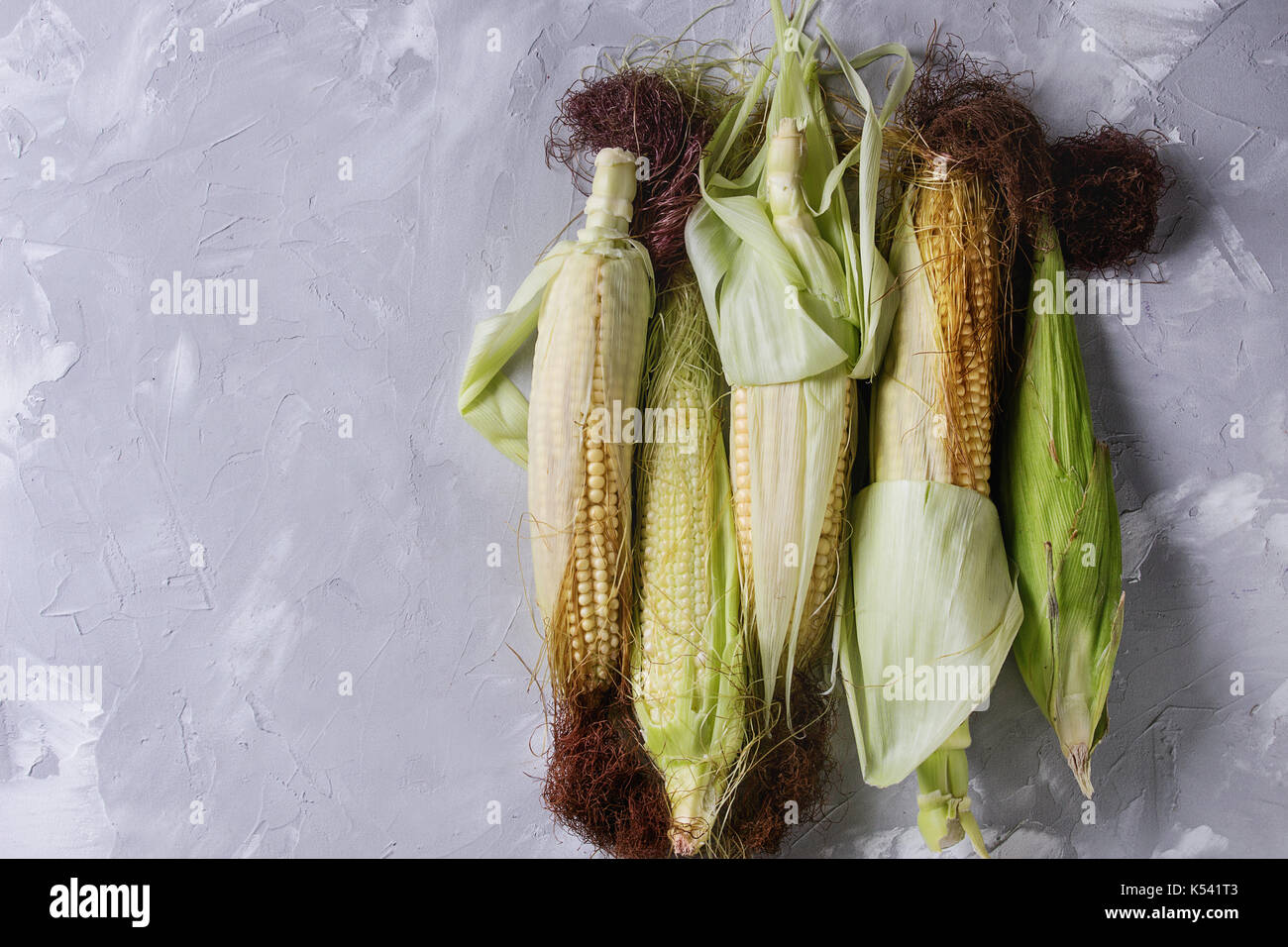 Young raw corn cobs Stock Photo - Alamy